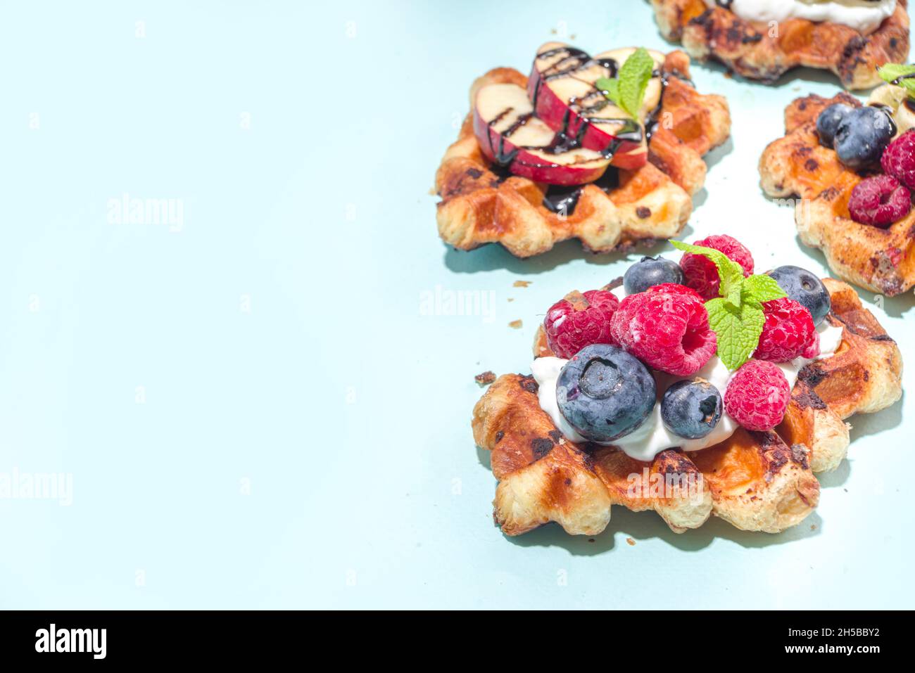 Modern dessert croffle - mixture of croissants and waffles, puff baking ...