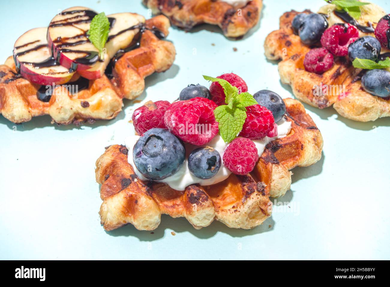 Modern dessert croffle - mixture of croissants and waffles, puff baking ...