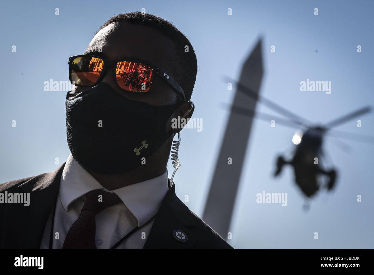 The South Portico of the White House is reflected in a member of the ...