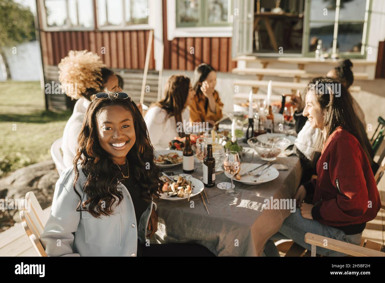 Young woman sitting dining table hi-res stock photography and images ...