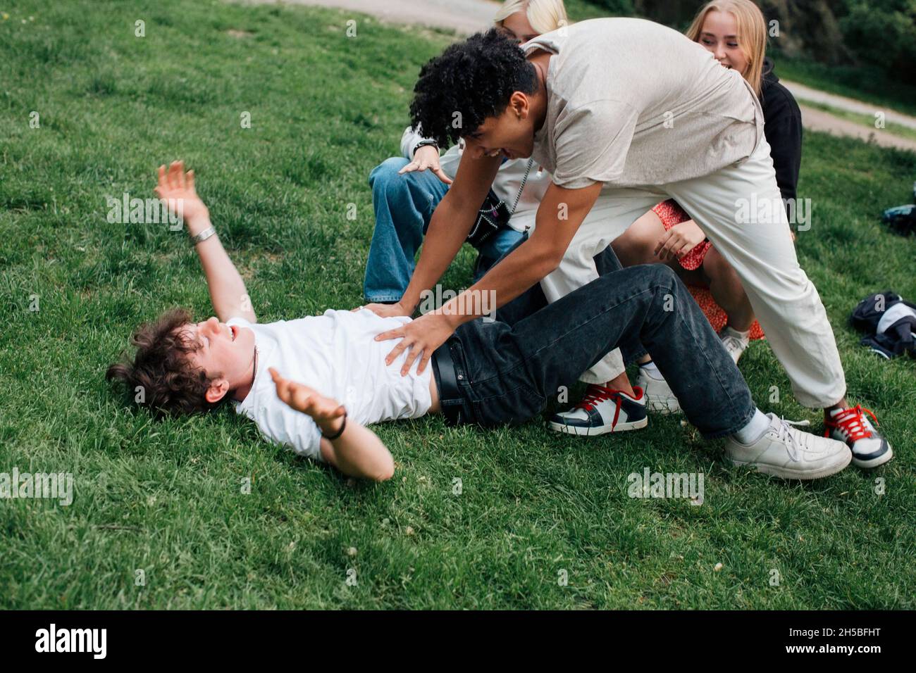 Playing in park hi-res stock photography and images - Alamy