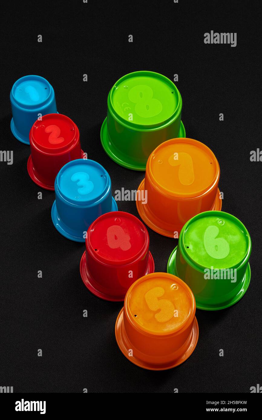 Multi coloured children’s play cups that can be stacked Stock Photo - Alamy