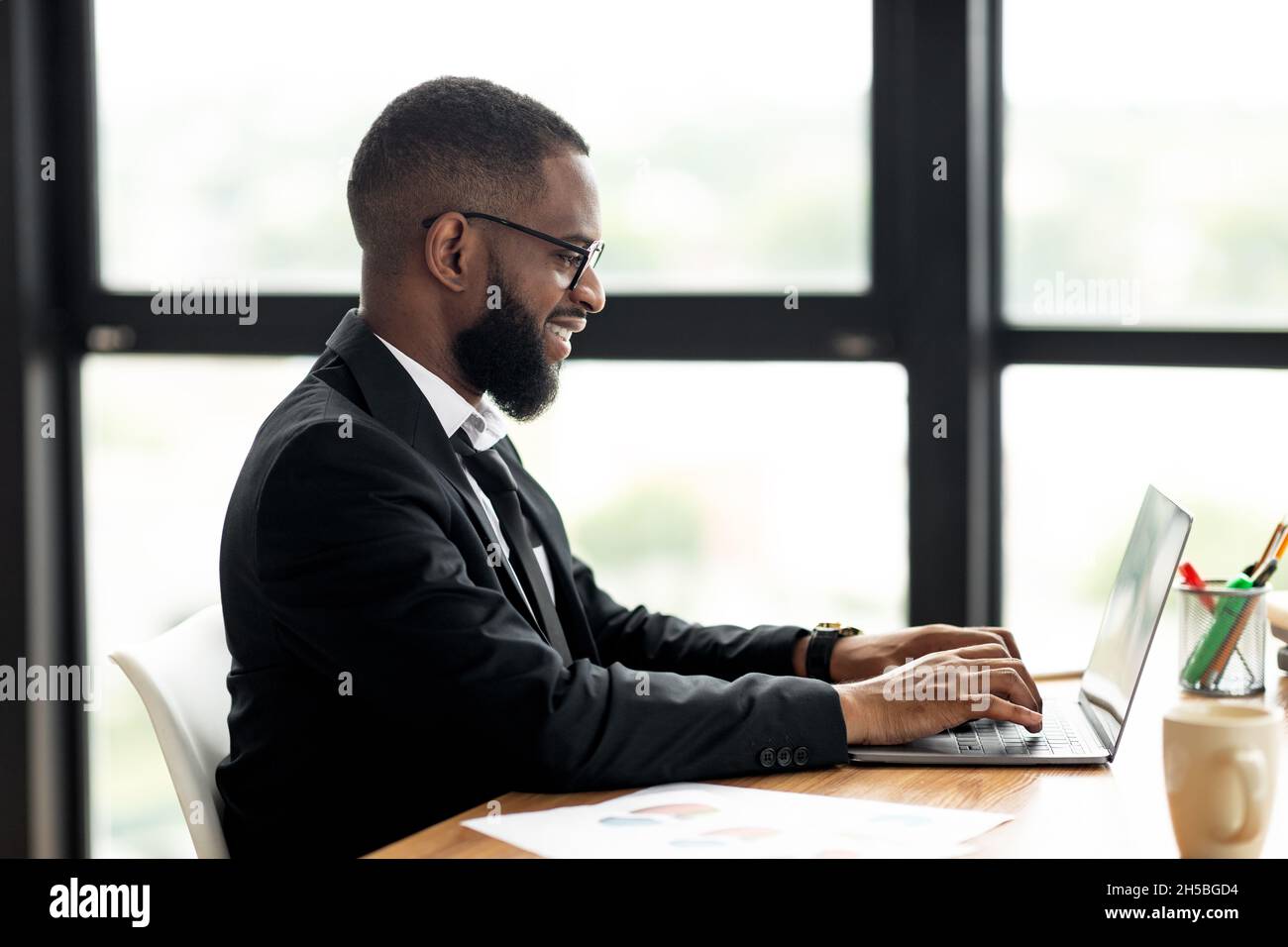 African american man using typing hi-res stock photography and images ...