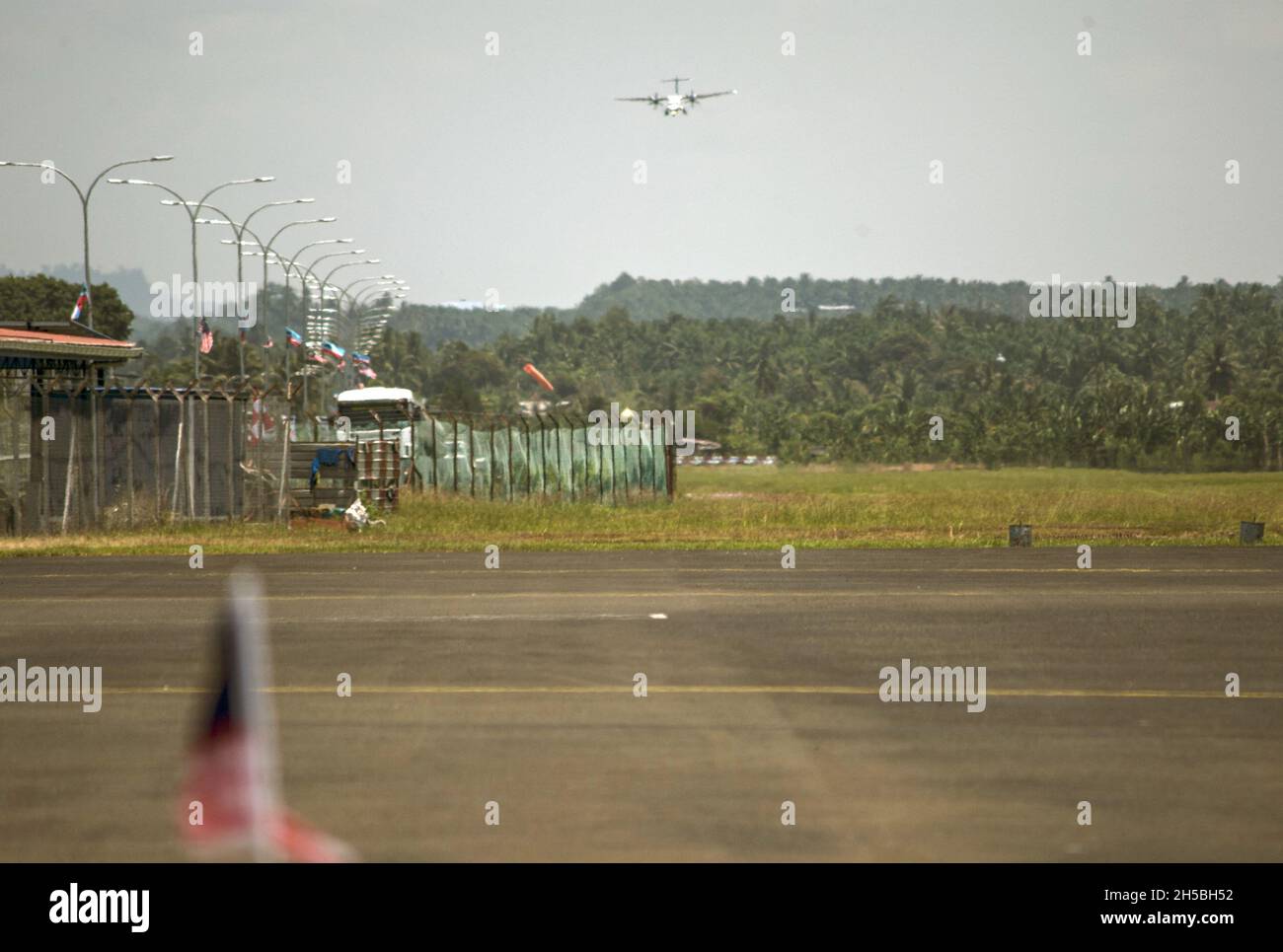 A airplane seen while landing in Lahad Datu airport, Sabah, Borneo ...