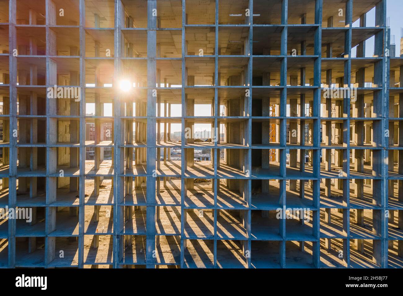 Sun shining through the concrete cells on the construction site. Frame ...