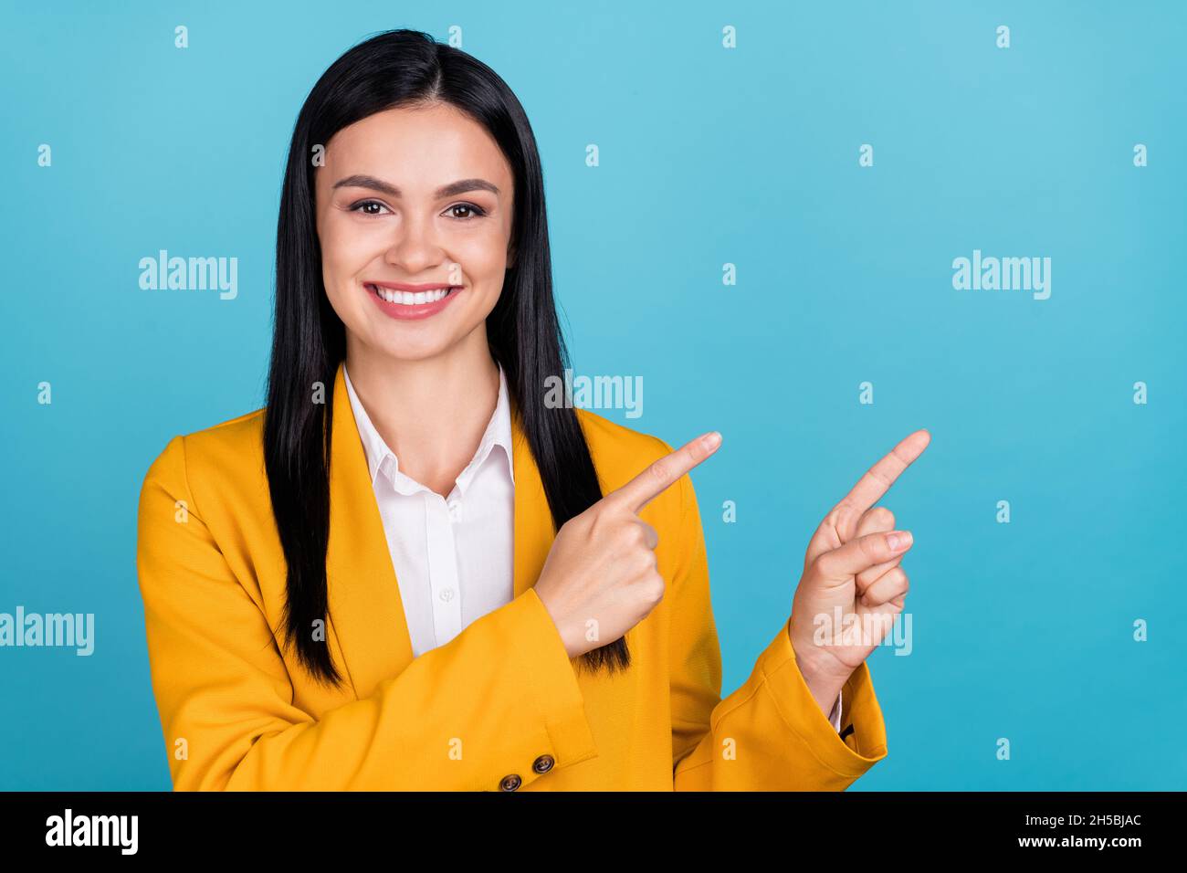 Photo of charming nice happy cheerful business lady point fingers empty ...