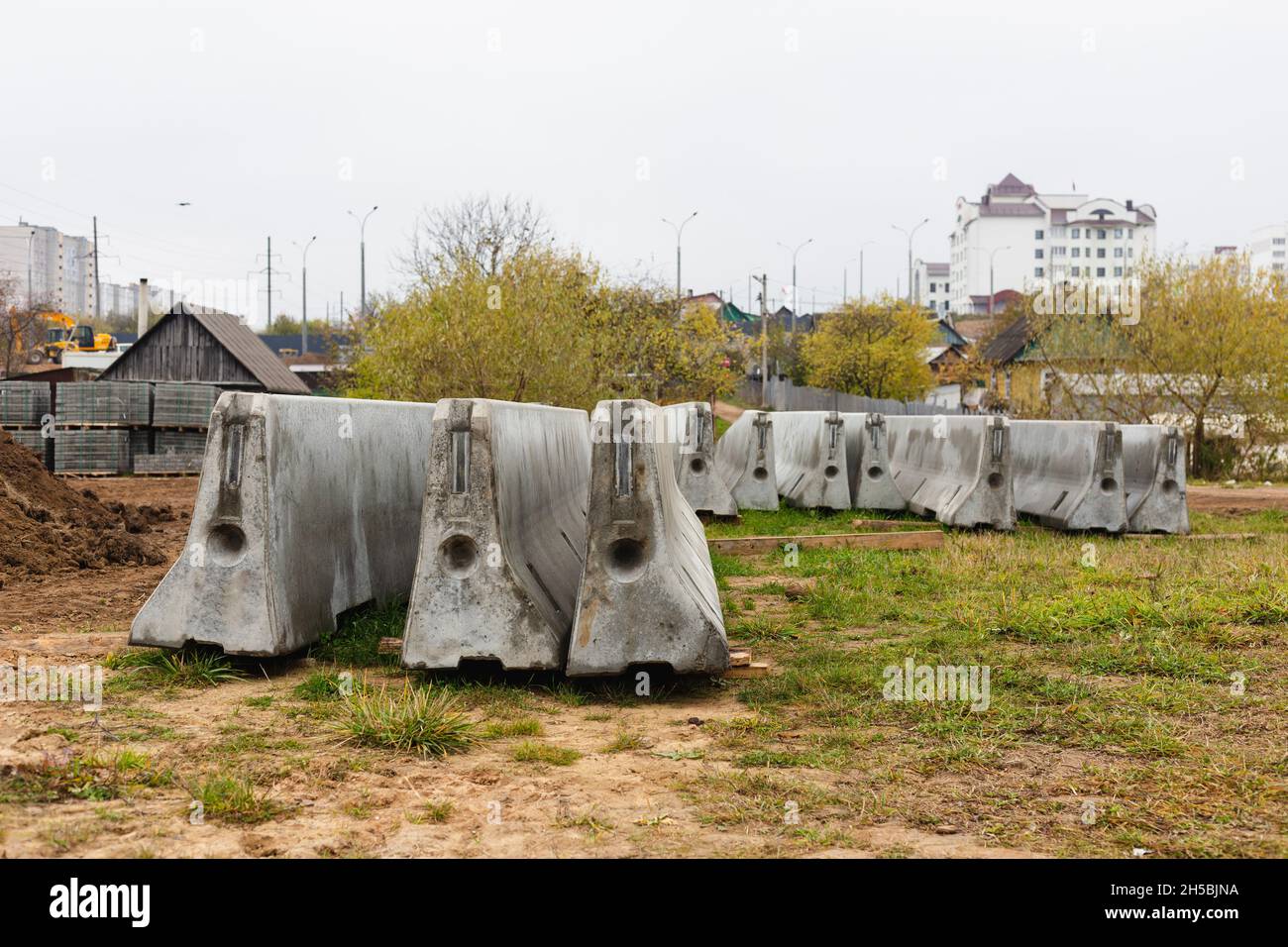 Concrete bumpers at a construction site. Chippers for traffic safety ...