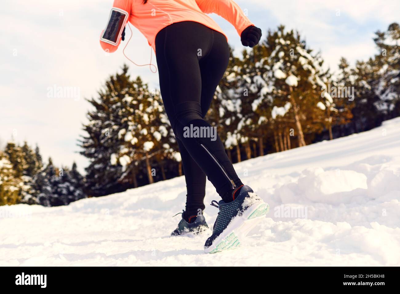 Slim girl running winter landscape woman fitness jogging hi-res stock ...
