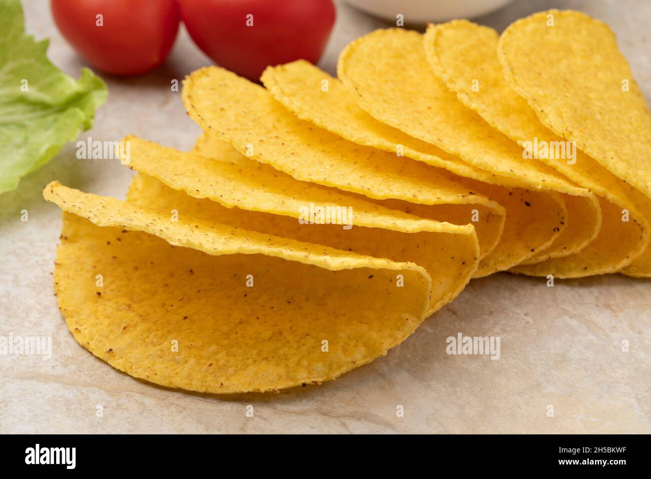 Empty mexican taco shells close up on a stone background ready to fill ...