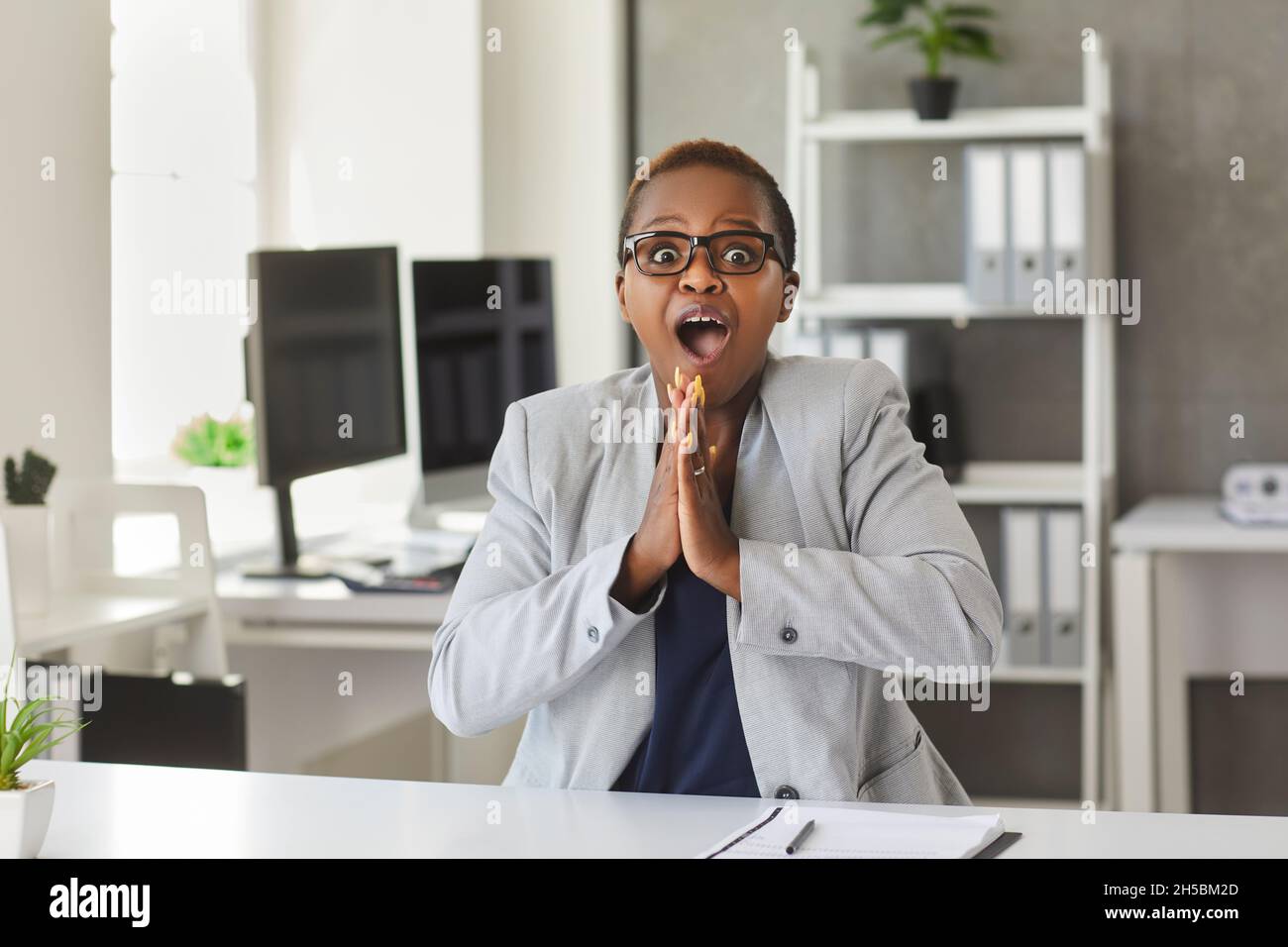 Portrait of a pleasantly surprised and happy African American woman who ...