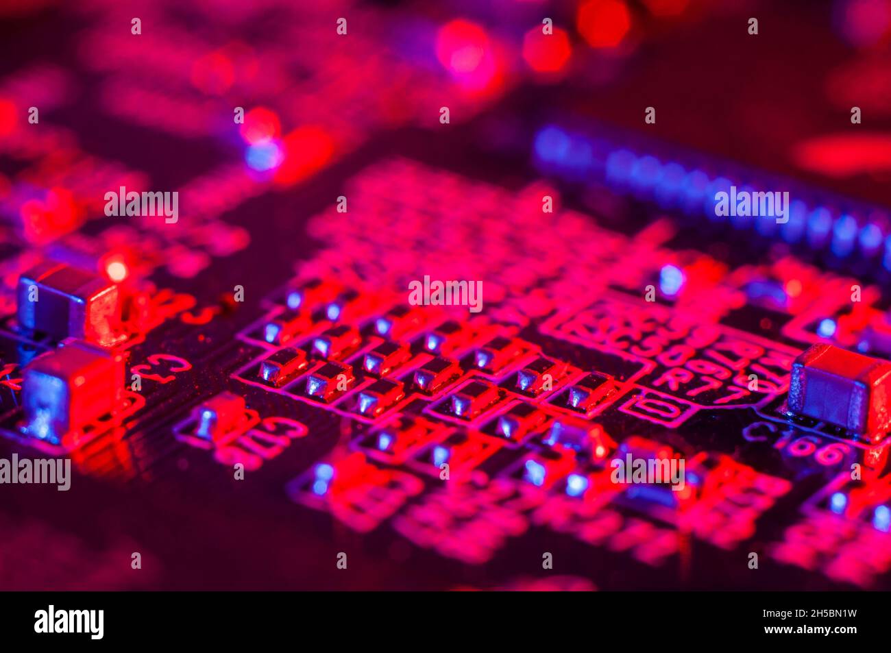 Circuit board close up in bright red light Stock Photo - Alamy