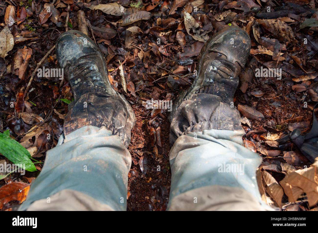 Trapper boots soiled with mud during trekking, Tourist and expedition ...