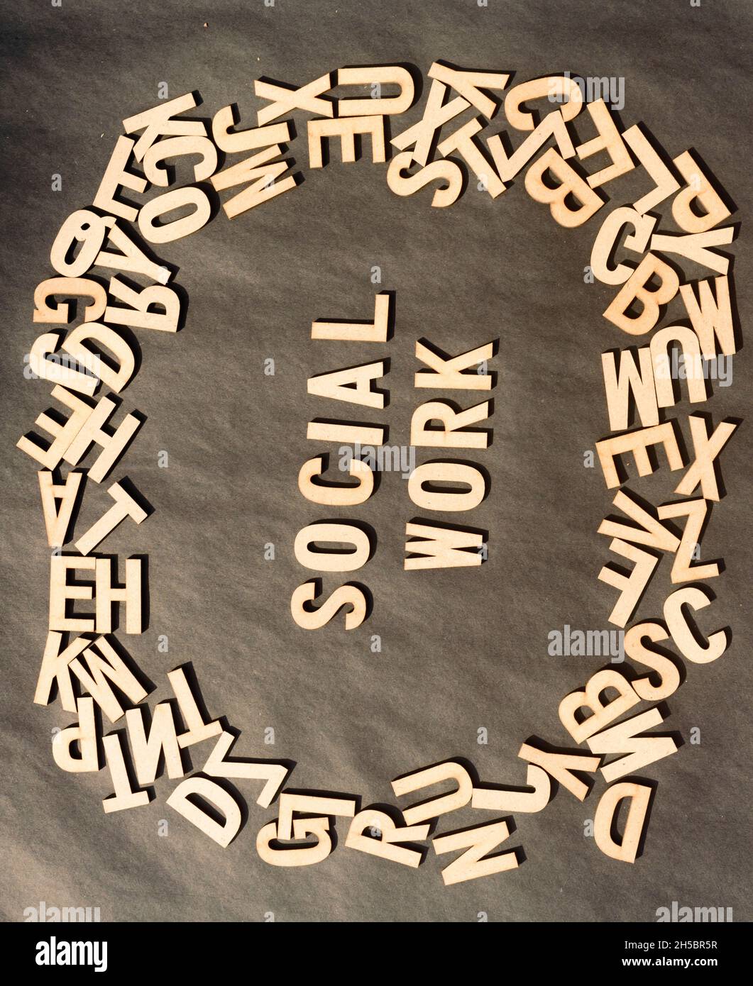Social Work In Wooden Cube Alphabet Letters Top View On A rustic paper ...