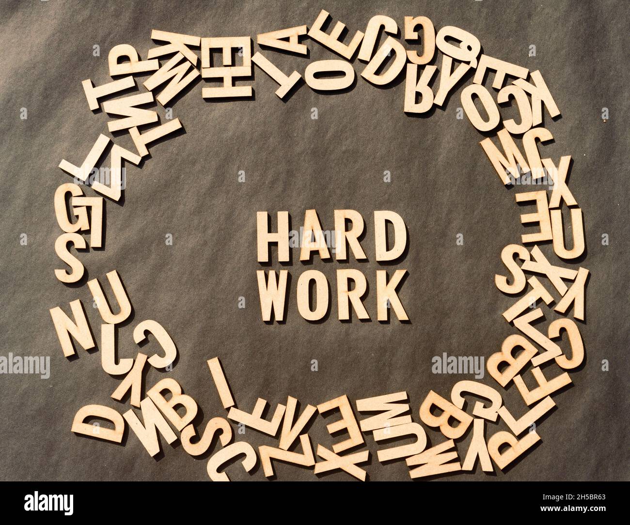 Work Hard Word In Wooden Cube Alphabet Letters Top View On A rustic ...