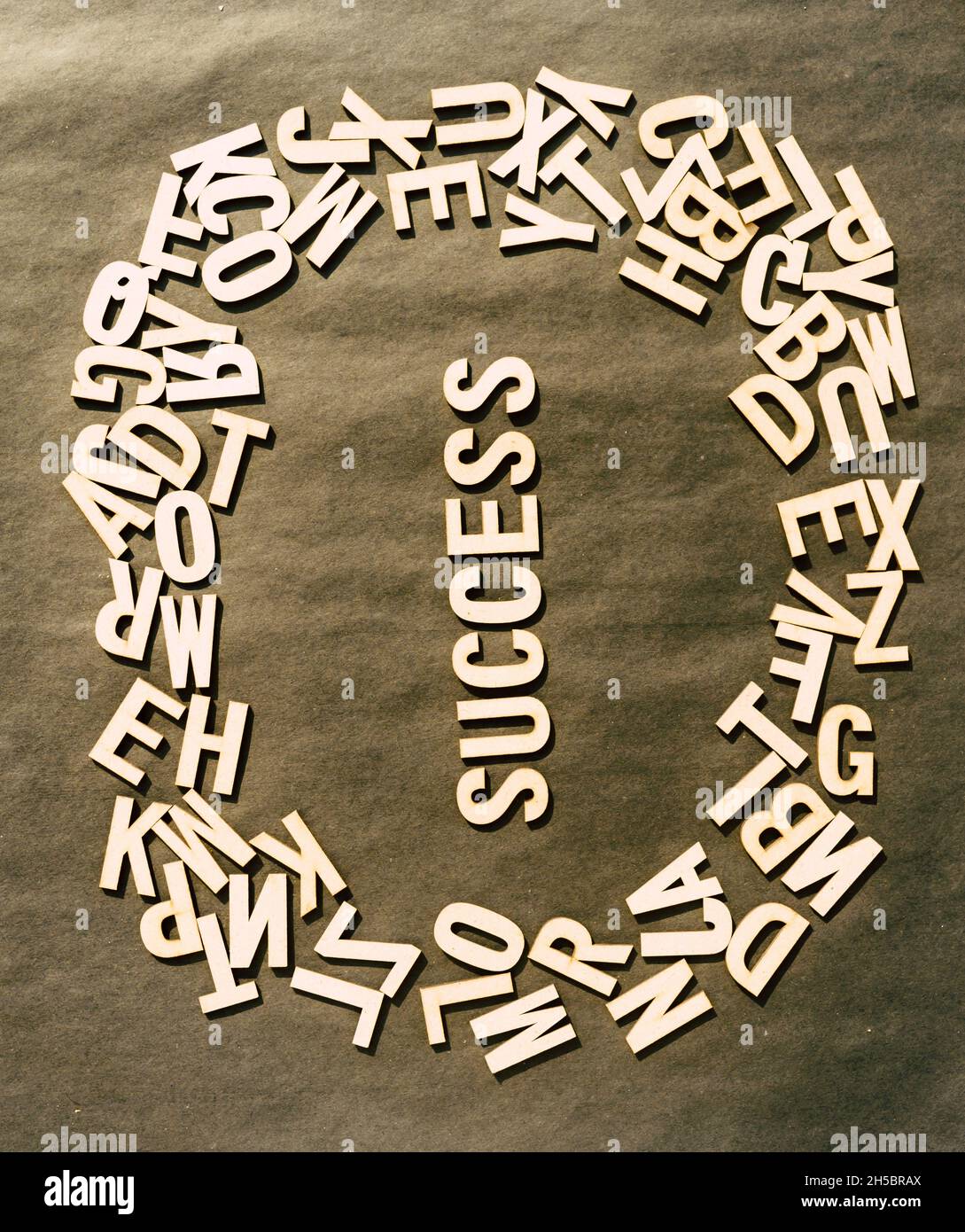Success Word In Wooden Cube Alphabet Letters Top View On A rustic paper ...