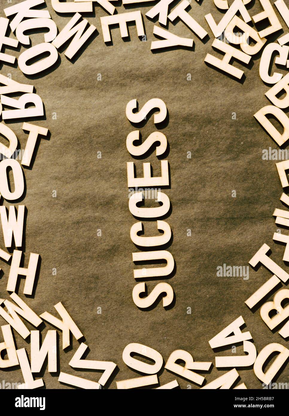 Success Word In Wooden Cube Alphabet Letters Top View On A rustic paper ...