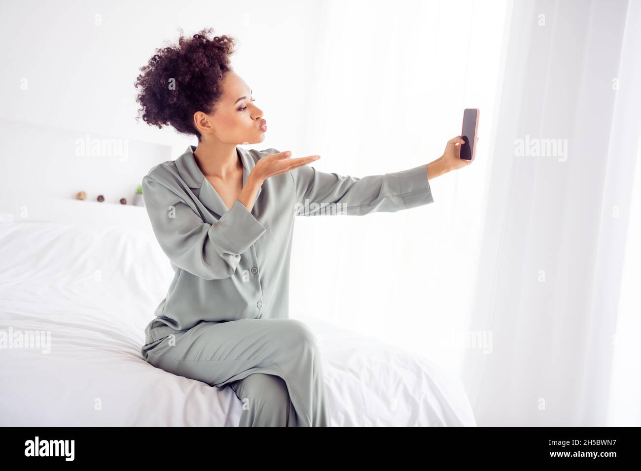 Photo of romantic affectionate lady take selfie portrait send bedtime ...