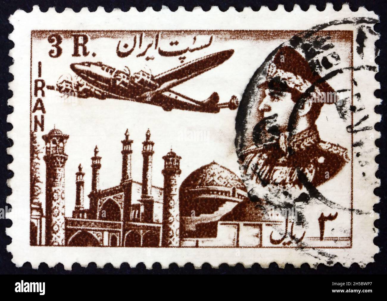 IRAN - CIRCA 1953: a stamp printed in Iran shows Plane above Mosque ...