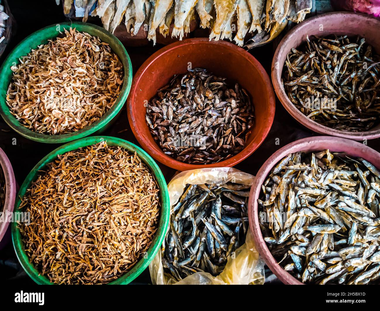 Dried fish on basket in market. The salted dried fish is hung on by the ...