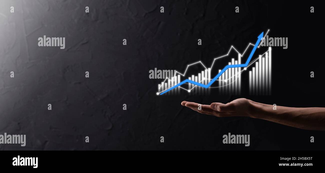 Businessman holding graph growth and increase of chart positive ...