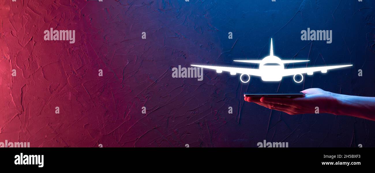 Male hand holding plane airplane icon on blue background. Banner.nline ...