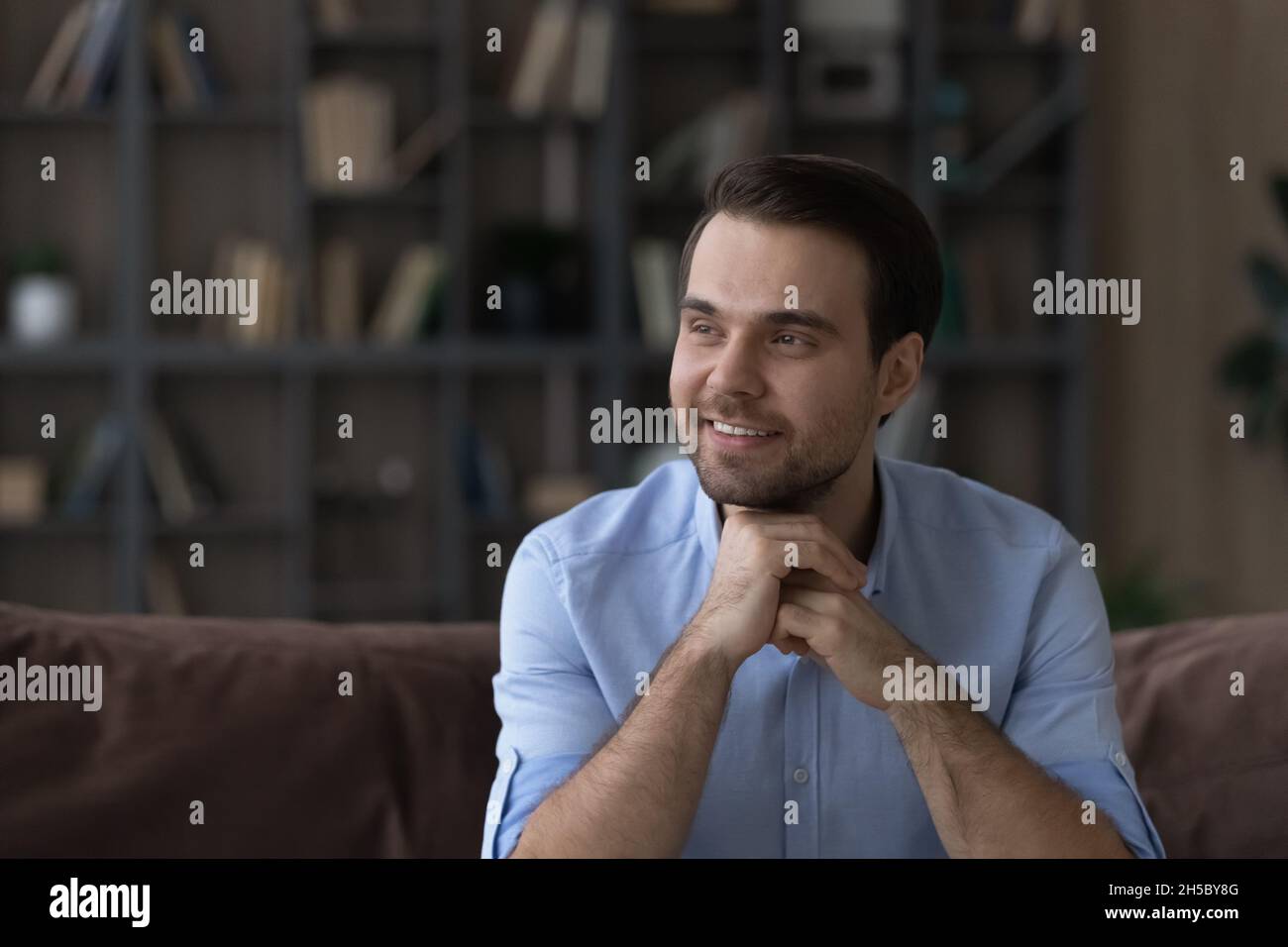 Dreamy young happy handsome man looking in distance Stock Photo - Alamy