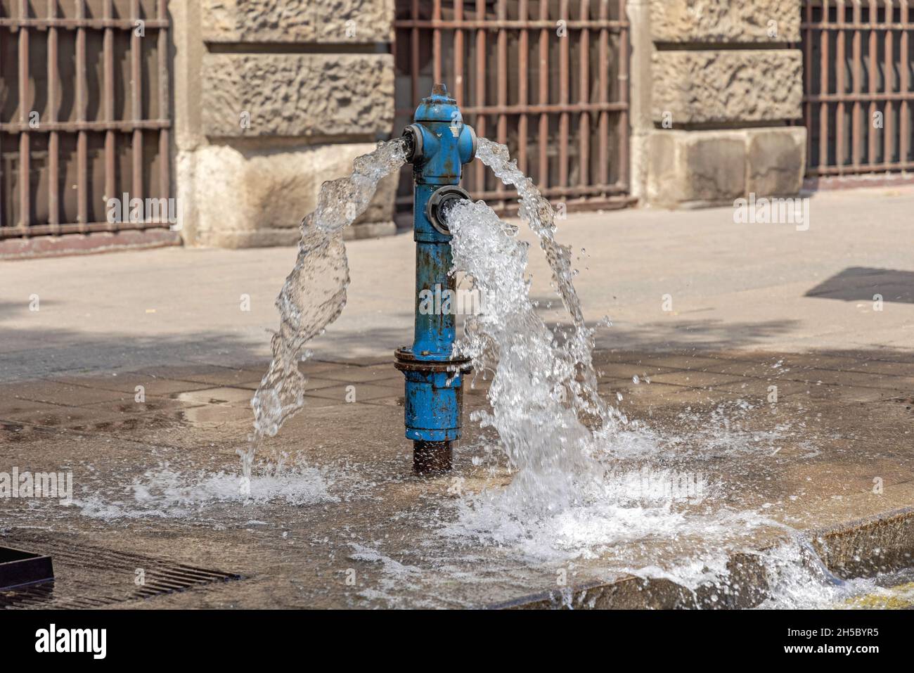 Water Flow at Street From Open Fire Hydrant Pipe Stock Photo - Alamy