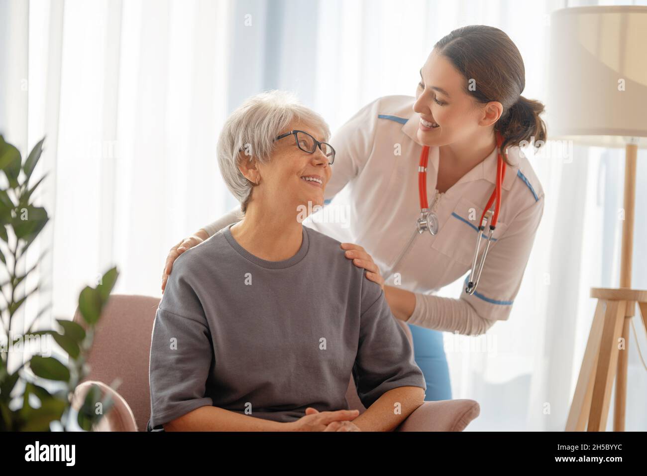 Female patient listening to a doctor in hospital Stock Photo - Alamy