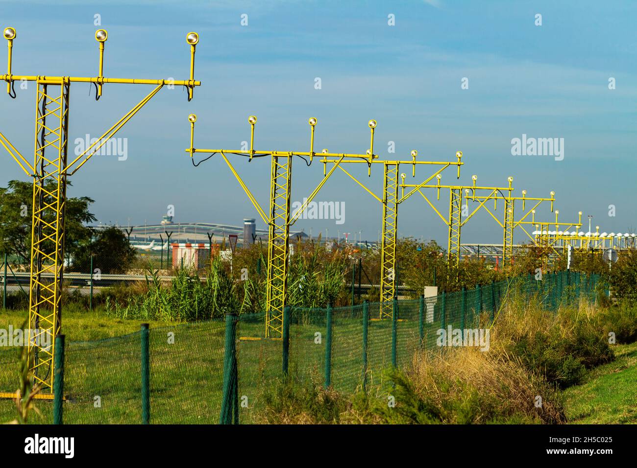 View of lyellow runway approach light pole at the airport in Barcelona ...
