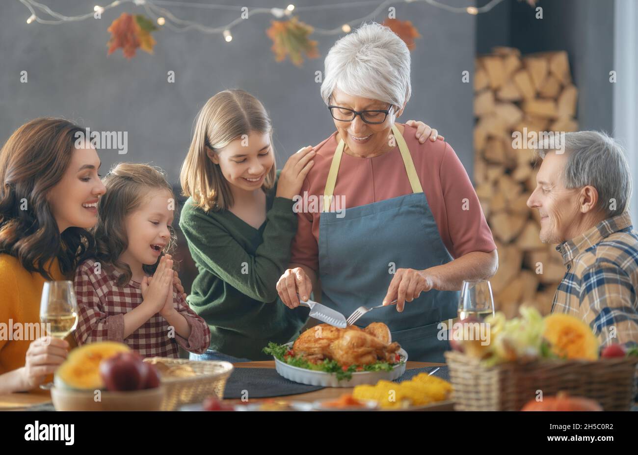 Thanksgiving Day, Autumn feast. Happy family sitting at the table and ...