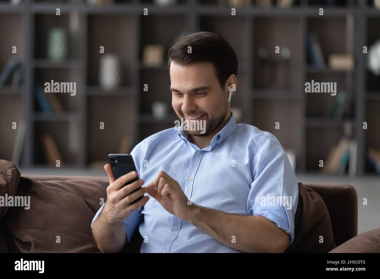 Happy millennial man holding video call conversation Stock Photo - Alamy