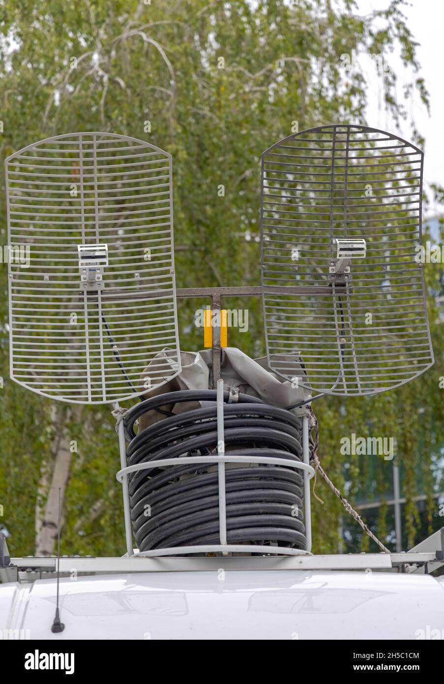 Link Antenna With Cable Coil at Top of Broadcasting Van Stock Photo - Alamy
