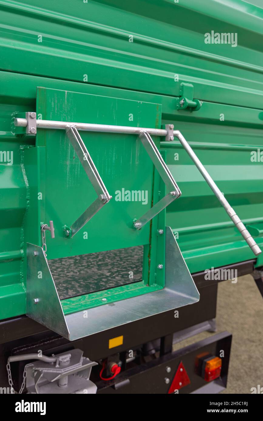 Manual Grain Gate Open Door at Farm Tipping Trailer Stock Photo - Alamy