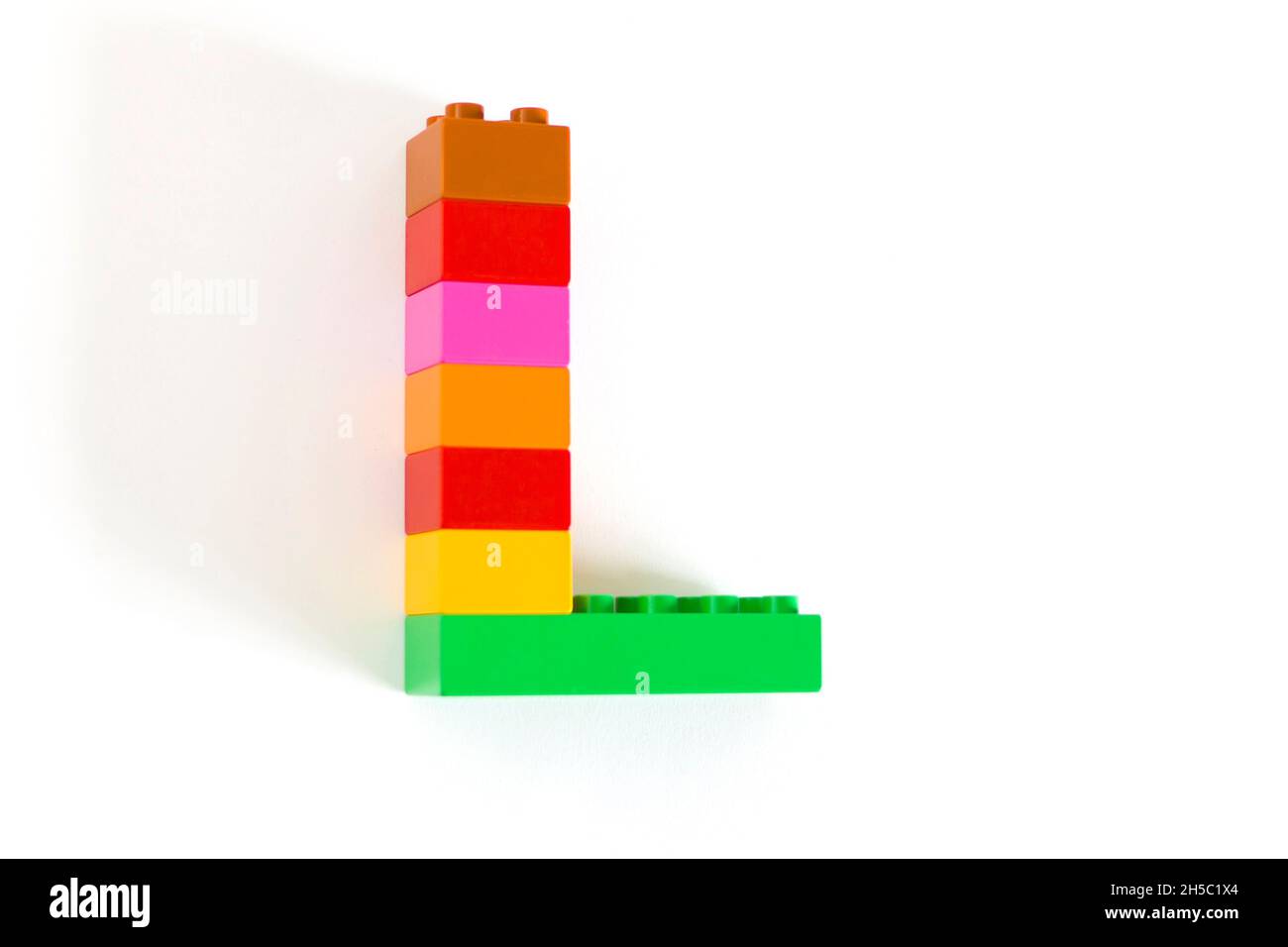 Colorful toy brick letter L isolated on the white background Stock ...
