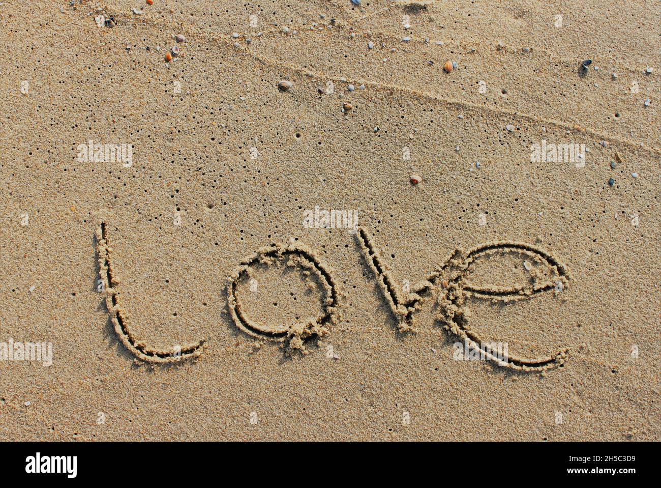 Sand beach writing message hi-res stock photography and images - Alamy