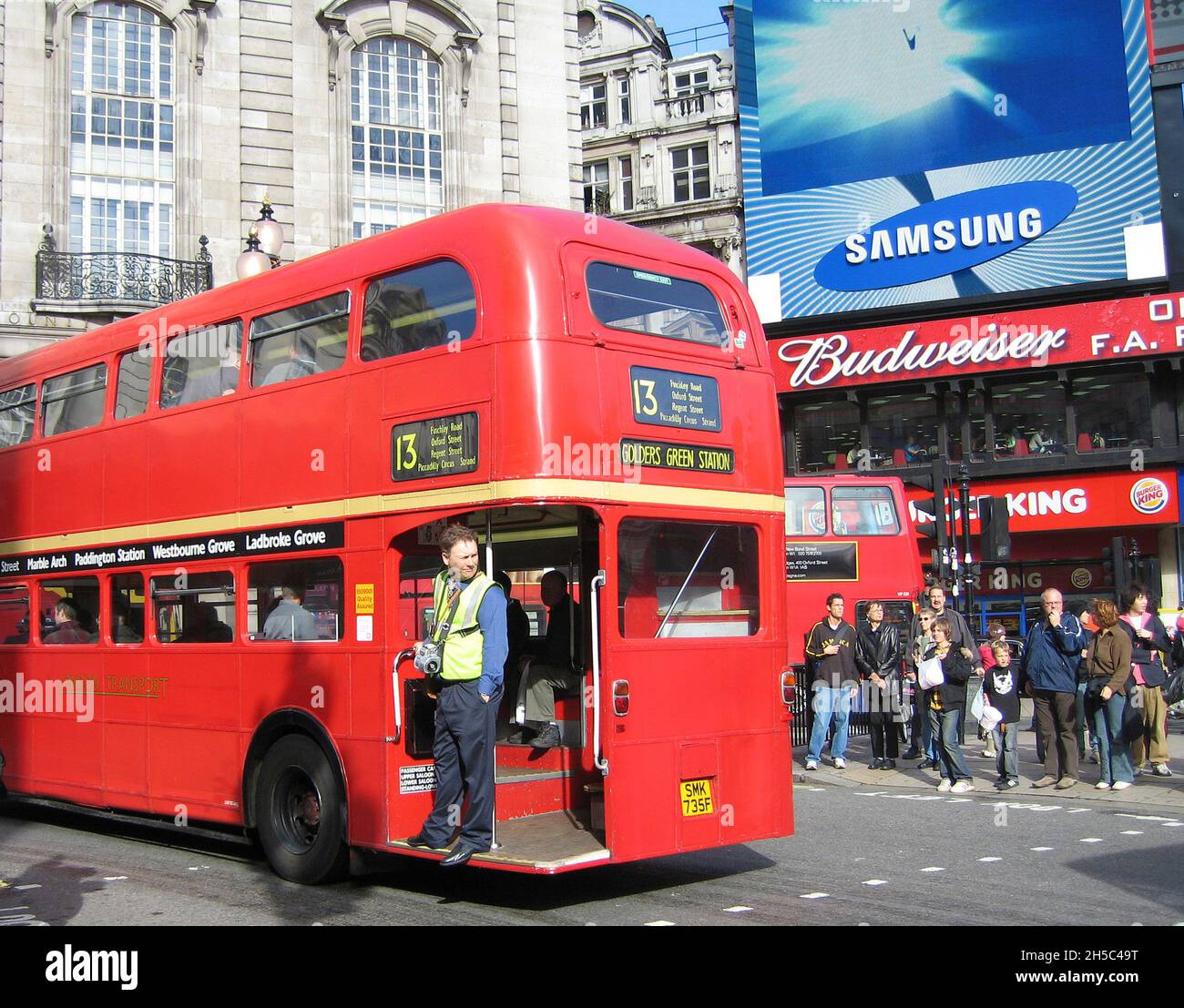 Conductor on Routemaster in Piccadilly Circus Stock Photo - Alamy