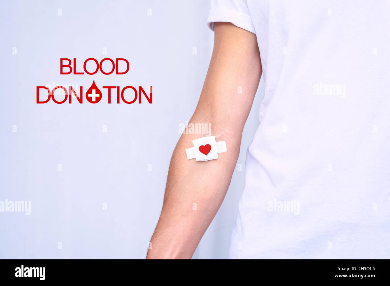 World blood donor day. Blood donation. Blood donor with bandage after ...