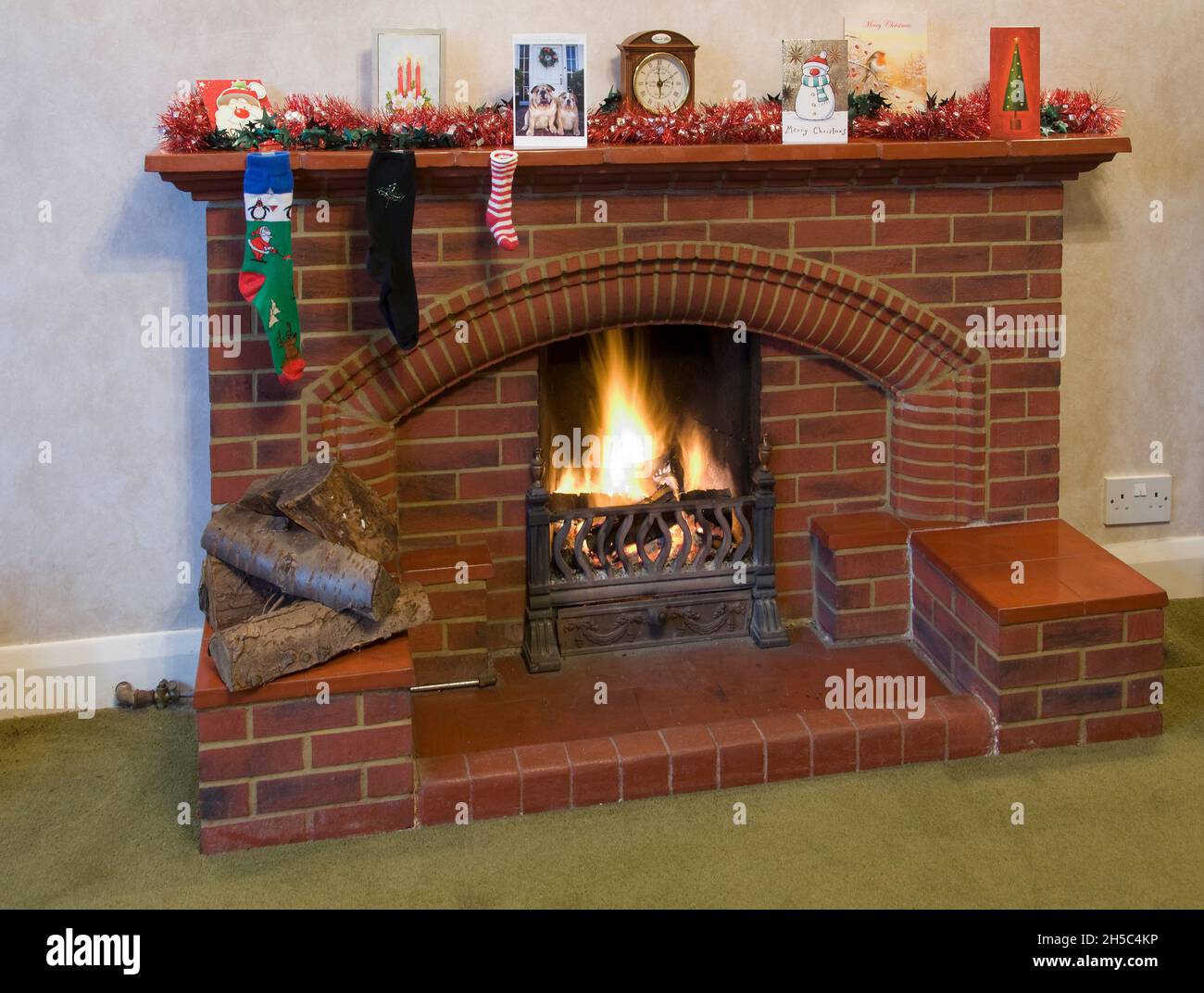 Traditional brick fireplace decorated christmas roaring fire car hi-res ...