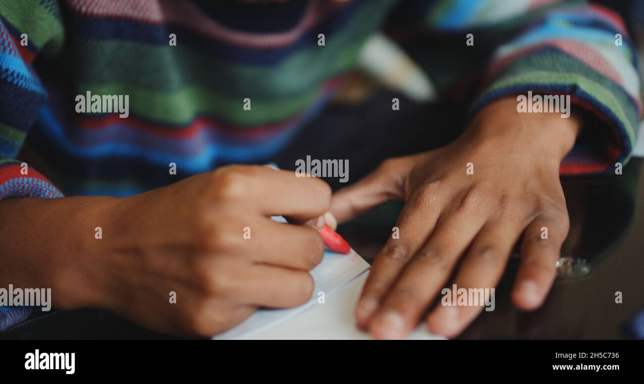 Portrait of a South Asian kid drawing Stock Photo - Alamy