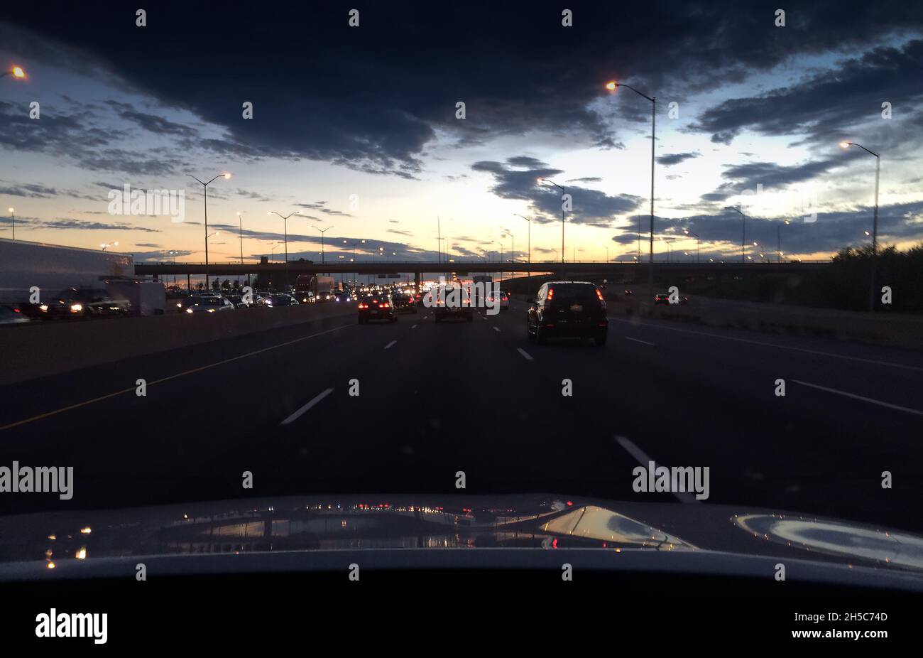 Traffic driving along a motorway at dusk, Toronto, Ontario, Canada ...