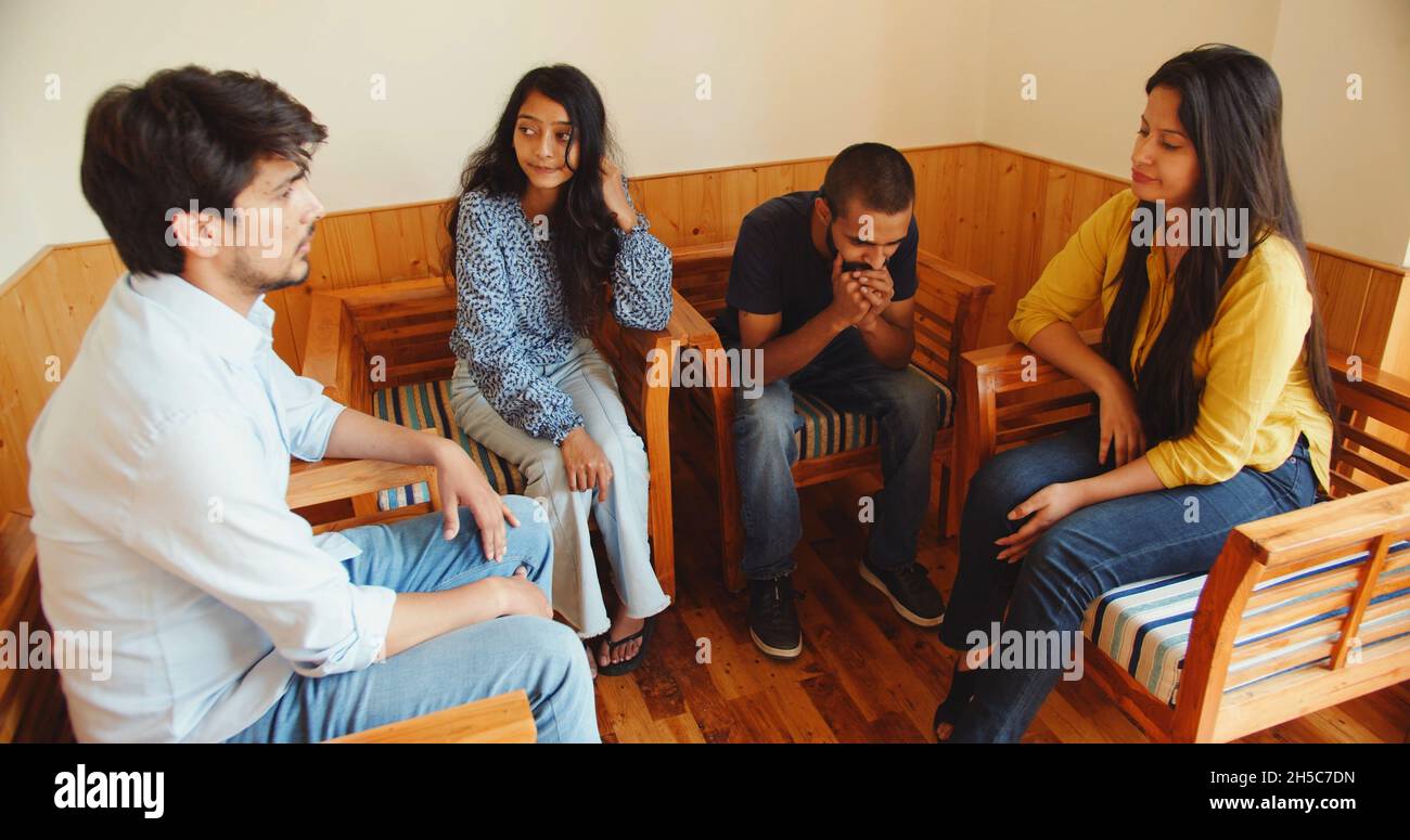 Group of south Asian friends sitting and talking Stock Photo - Alamy
