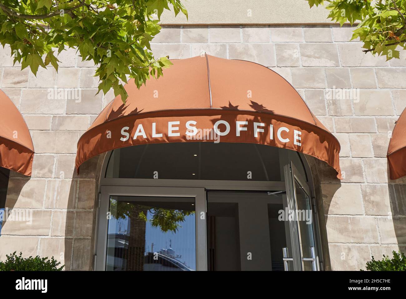 Signboard sales office on the facade of the building Stock Photo - Alamy