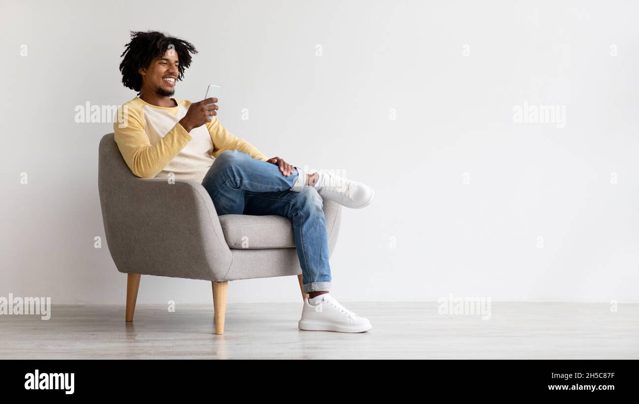 Mobile Communication. Young Black Guy Messaging On Smartphone While ...