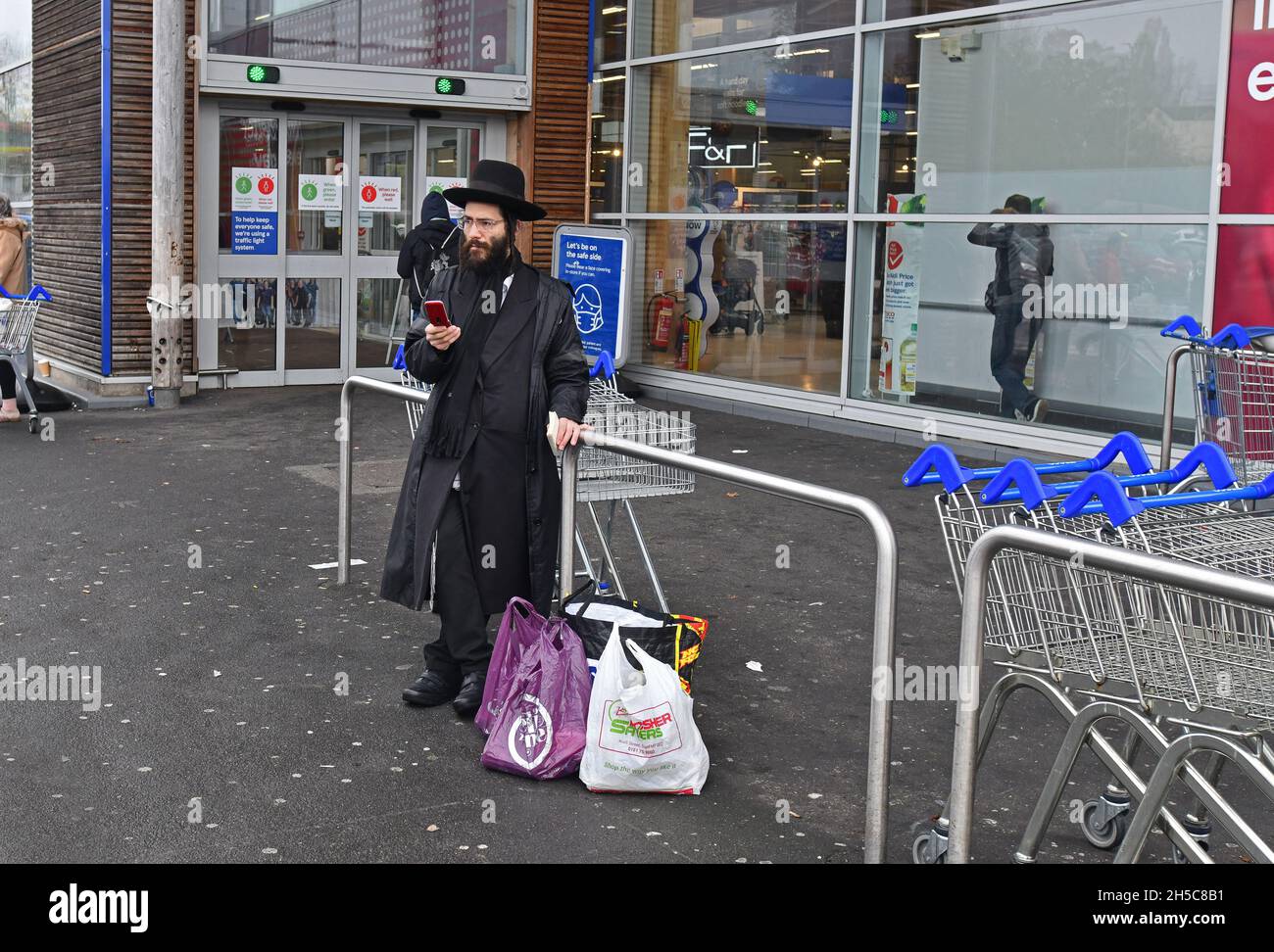 Orthodox Jewish man outside Tesco Supermarket in Cheetham Hill, Greater ...