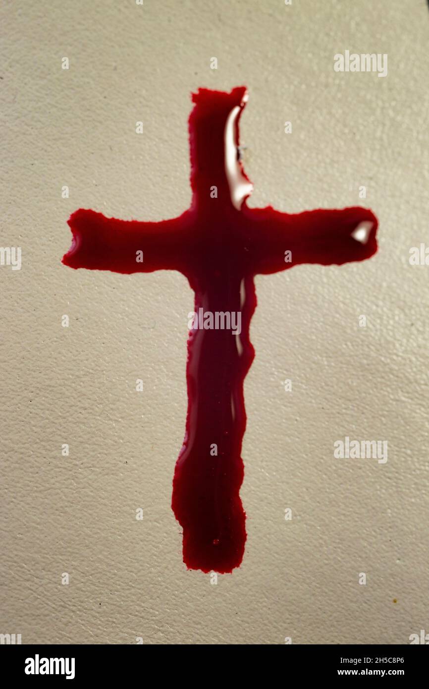crucifix made with blood on fake leather texture, macro Stock Photo - Alamy
