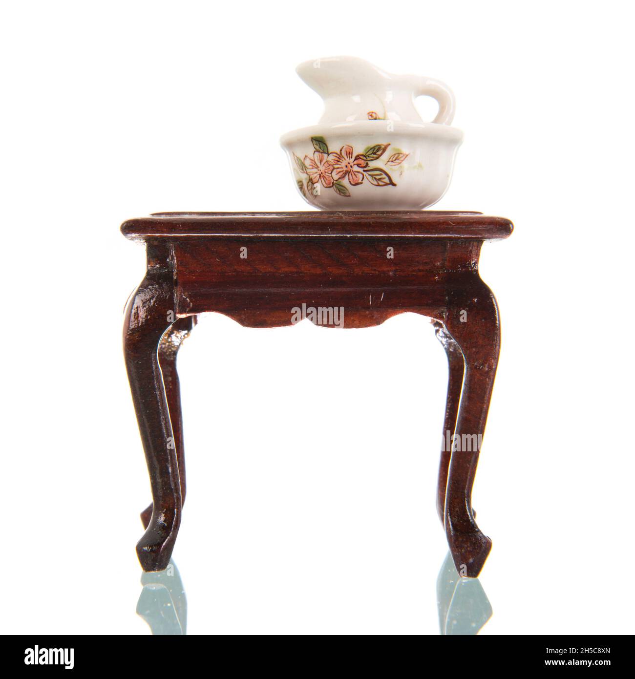 Queen ann style table with ewer isolated over white background Stock ...