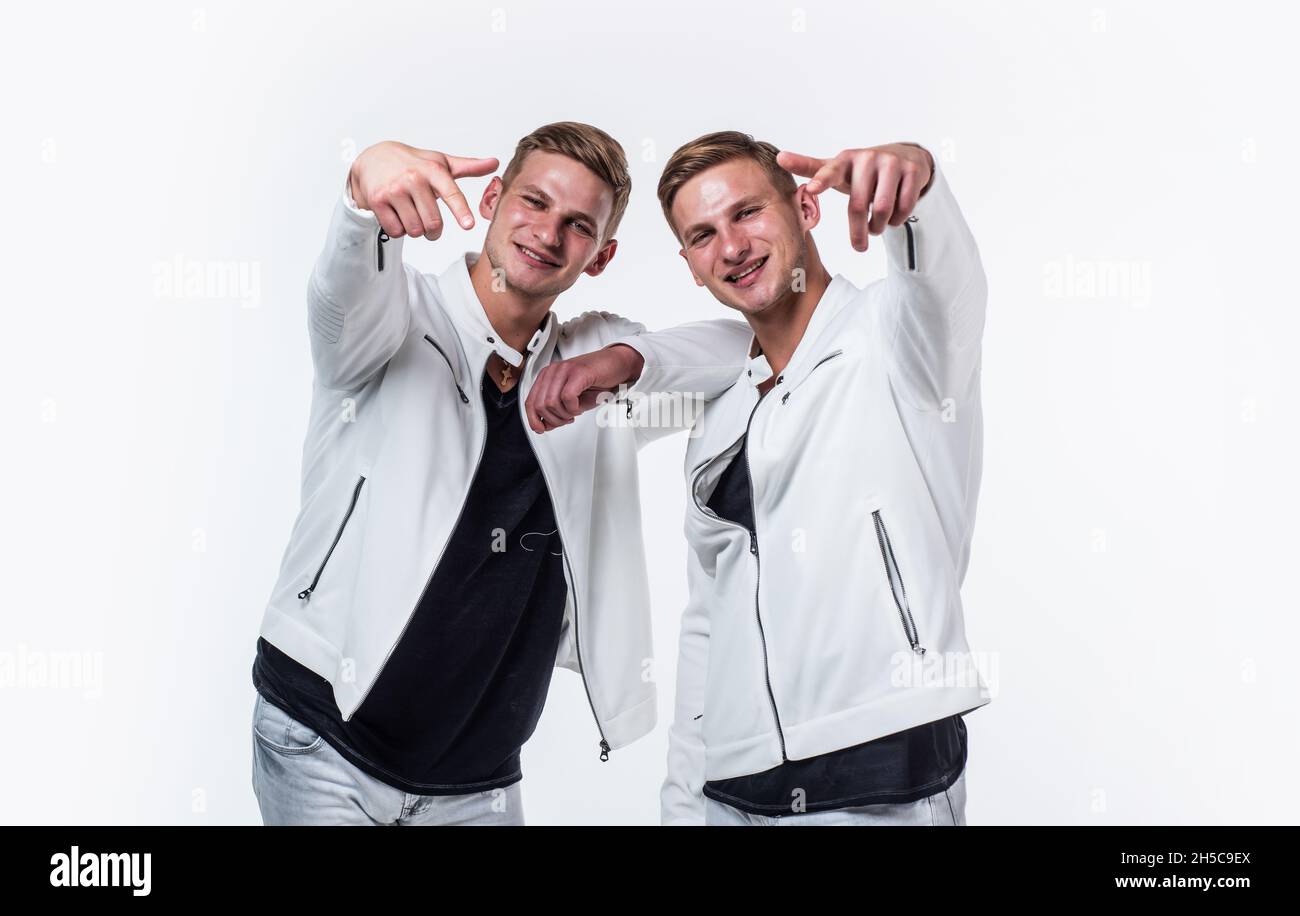 family relations and friendship. men friends. two cousin pointing ...