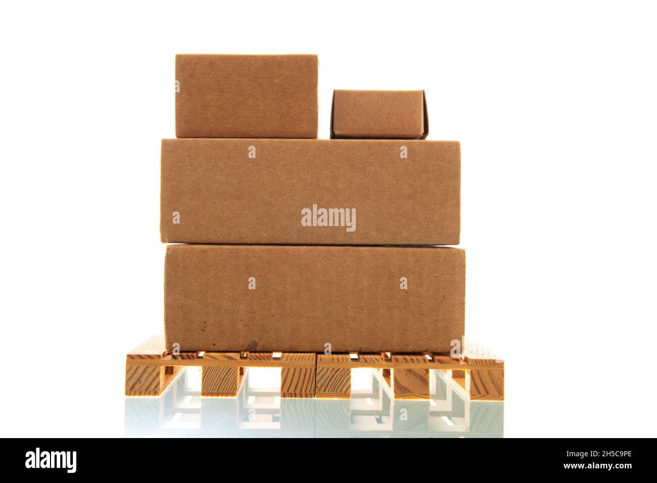 Carton boxes on pallet isolated over white background Stock Photo - Alamy