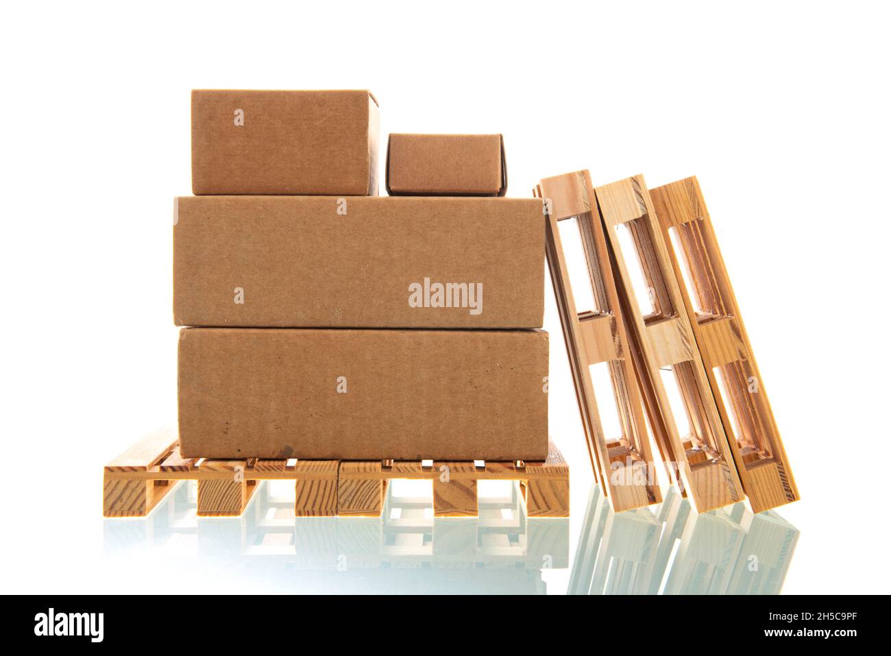 Carton boxes on pallet isolated over white background Stock Photo - Alamy