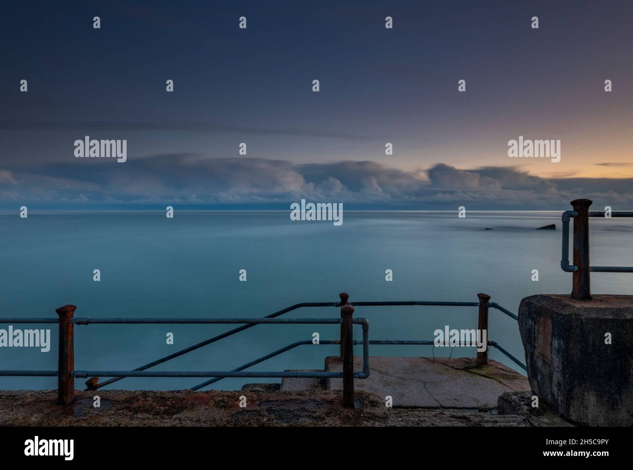 railings and seafront at freshwater bay on the isle of wight coastline ...